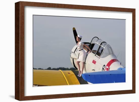 1940s Style Pin Up Girl Sitting On The Wing Of A Vintage T 6 Texan