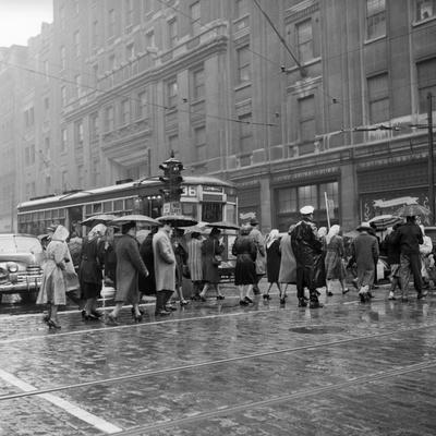 '1940s 1950s PEDESTRIAN INTERSECTION CITY CROSS WALK UMBRELLAS RAIN WET ...