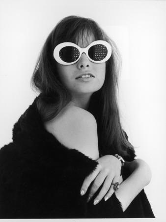 'A Brunette Model Wears an Off the Shoulder Fur Coat and Fab Sunglasses ...