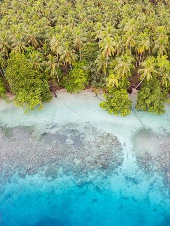 'A coral reef surrounds idyllic islands near New Britain in Papua New ...