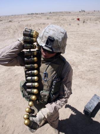 'A Marine Handles a String of 40 mm High-Explosive Grenades ...