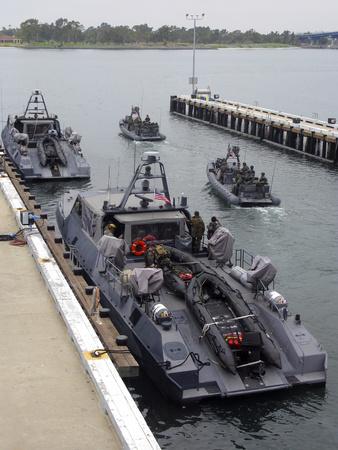 'A MK-V Special Operations Craft Tied Pierside Manned And Loaded with ...