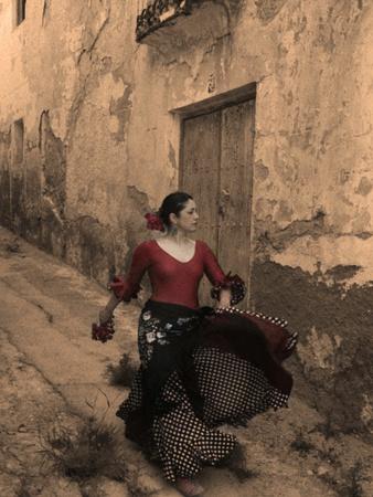 'A Spanish Woman Walking Along a Traditional Spanish Street Wearing a ...