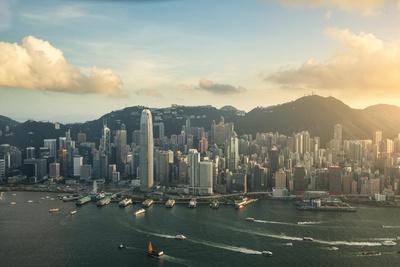 Aerial view of Hong Kong skyline and Victoria Harbor with blue sky in ...