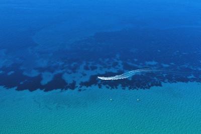 'Aerial view of speed boat in motion. Water transportation and summer ...