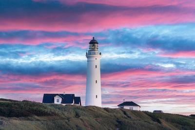 Amazing pink sunset view of Hirtshals lighthouse in Denmark. Landscape ...