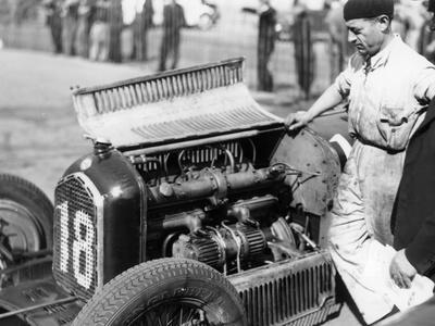 'Attilio Marinoni, Chief Mechanic of Scuderia Ferrari, with an Alfa ...
