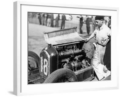 'Attilio Marinoni, Chief Mechanic of Scuderia Ferrari, with an Alfa ...