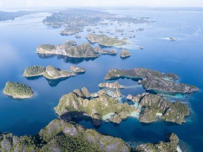 'Beautiful limestone islands rise from Raja Ampat's seascape. This ...