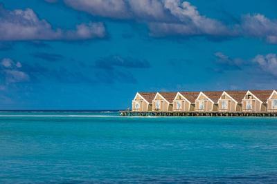 'Beautiful ocean lagoon with water bungalows at Maldives, sunny blue ...