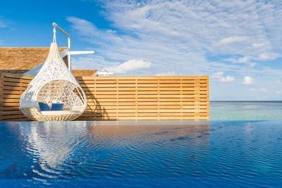 'Beautiful poolside and sunset sky. Luxurious tropical beach landscape ...