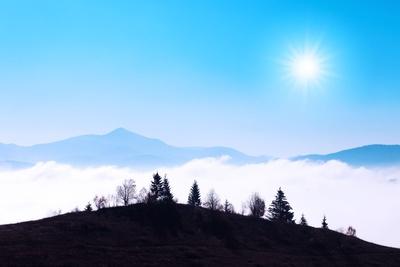 'Beauty blue mountains range with clear sky, bright sun and trees ...