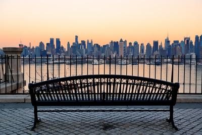 'Bench in Park and New York City Midtown Manhattan at Sunset with ...