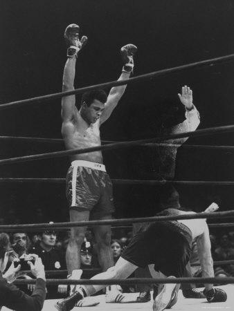 'Boxer Muhammad Ali Raising His Gloves Victoriously After Knocking Out ...