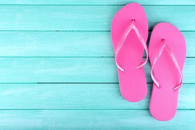 'Bright Flip-Flops on Color Wooden Background' Photographic Print ...