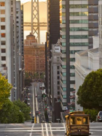 'Cable Car Crossing California Street With Bay Bridge Backdrop in San ...