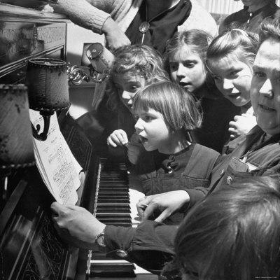 'Children Singing Around the Piano at Orphanage' Photographic Print ...