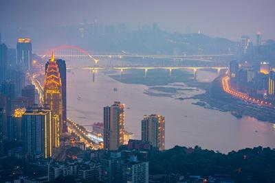 Chongqing, China downtown city skyline over the Yangtze River at sunset ...