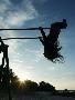 Girl Playing High on Swings at Sunset on Vosu Beach, Located in Lahemaa ...