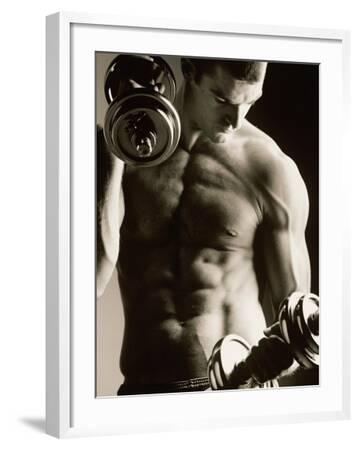'Close-up of a Young Man Working Out with Dumbbells' Photographic Print ...