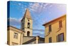 'Close-up of colorful buildings, bell tower and rooftops in a blue ...