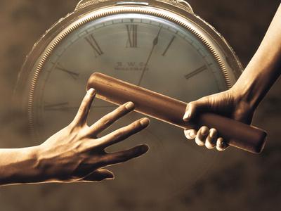 'Close Up of Two Runners Hands Passing the Baton in Relay Race in Front ...