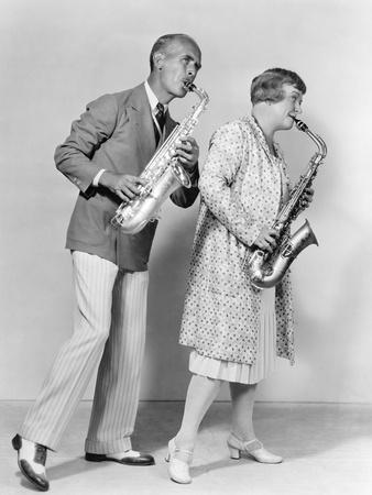 'Couple Playing Saxophones Together' Photo | AllPosters.com