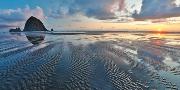 'Sunset golden colors with ripples in sandy beach and The Haystack Rock ...
