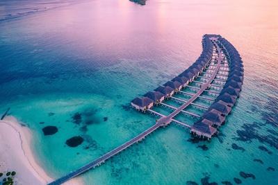 'Drone photo wooden water villas seen from above and an amazing blue ...