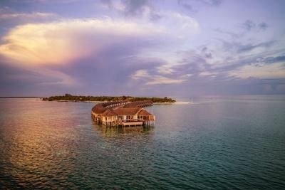'Drone photo wooden water villas seen from above and an amazing blue ...