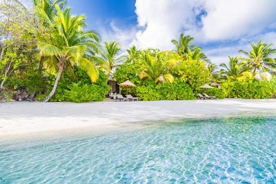 'Exotic beach landscape, two sun chairs and umbrella. Relaxation ...
