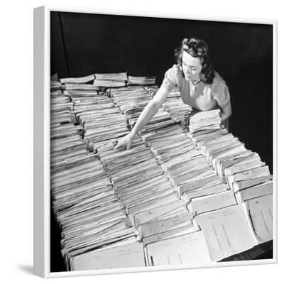 'File Clerk at the Fbi Working with a Table Covered with Files ...