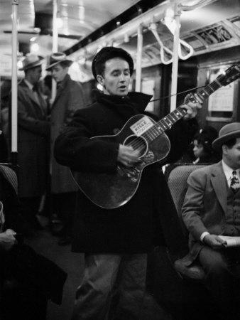 'Folk Singer Woody Guthrie Singing Aboard a Subway Train' Premium ...