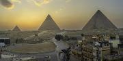 'View of Giza Pyramids from rooftop terrace at sunset, Cairo, Egypt ...