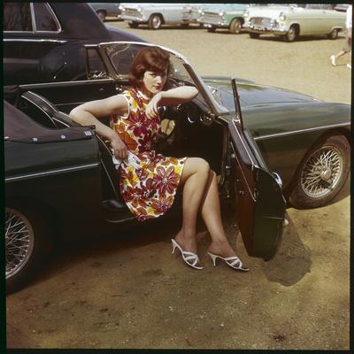 'Girl in a Classic Racing Green "MGB" Sports Car' Posters | AllPosters.com