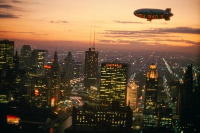 'Goodyear Blimp Sails over Midtown Manhattan Skyline at Dusk, New York ...