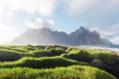 'Gorgeous landscape with black sand desert dunes and grassy bumps near ...