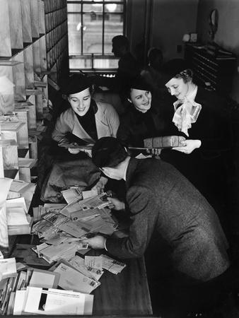 'Group of People Going Through a Pile of Mail' Photo | AllPosters.com
