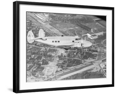 'Howard Hughes Lockheed 14 Super Electra over Worlds Fair Site ...
