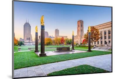Indianapolis, Indiana, USA monuments and downtown skyline at dusk ...