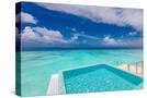 'Infinity swimming pool with sea and ocean view on blue sky background ...
