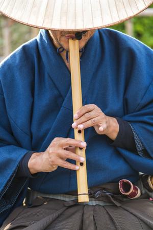 'Japanese man playing traditional wooden flute, Kyoto, Japan ...
