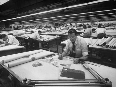 'Man at Table with Various Drafting Equipment, Working in Enormous ...