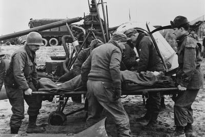 'Medics Carry a Wounded U.S. Soldier Away from a Rescue Helicopter ...