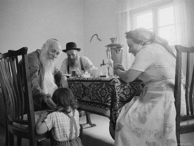 'Members of a Jewish Family Sitting Down For a Meal' Photographic Print ...