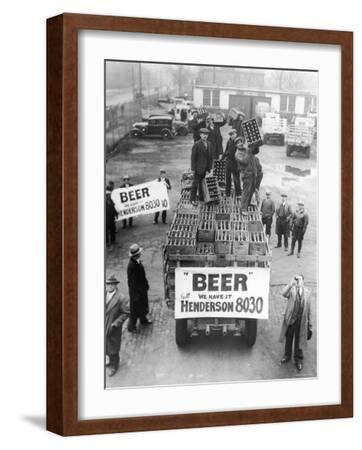 'Men Atop Beer Delivery Truck Hoist Cases of Beer Triumphantly While ...