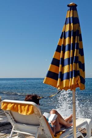 'Reading by the Sea' Photographic Print - nicolethonon | AllPosters.com