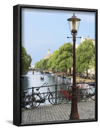'Old Gas Lamp Post and Bicycles on a Bridge over a Canal in Amsterdam ...