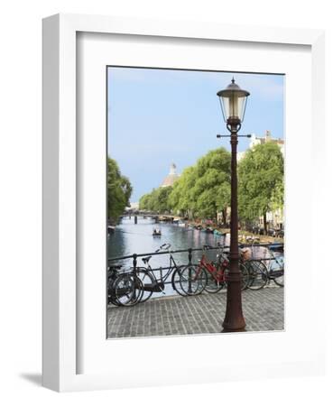 'Old Gas Lamp Post and Bicycles on a Bridge over a Canal in Amsterdam ...
