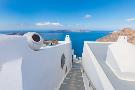 'Peaceful view in Santorini, Greece with white architecture flowers ...